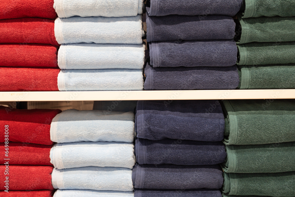 Multi colors Stack of bath towels. towels in a stack on the shelves in ...