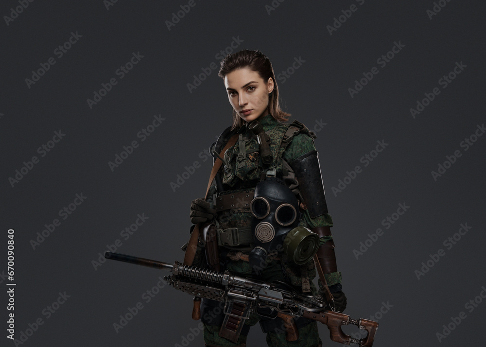 Portrait of a female soldier in military attire, holding a homemade ...