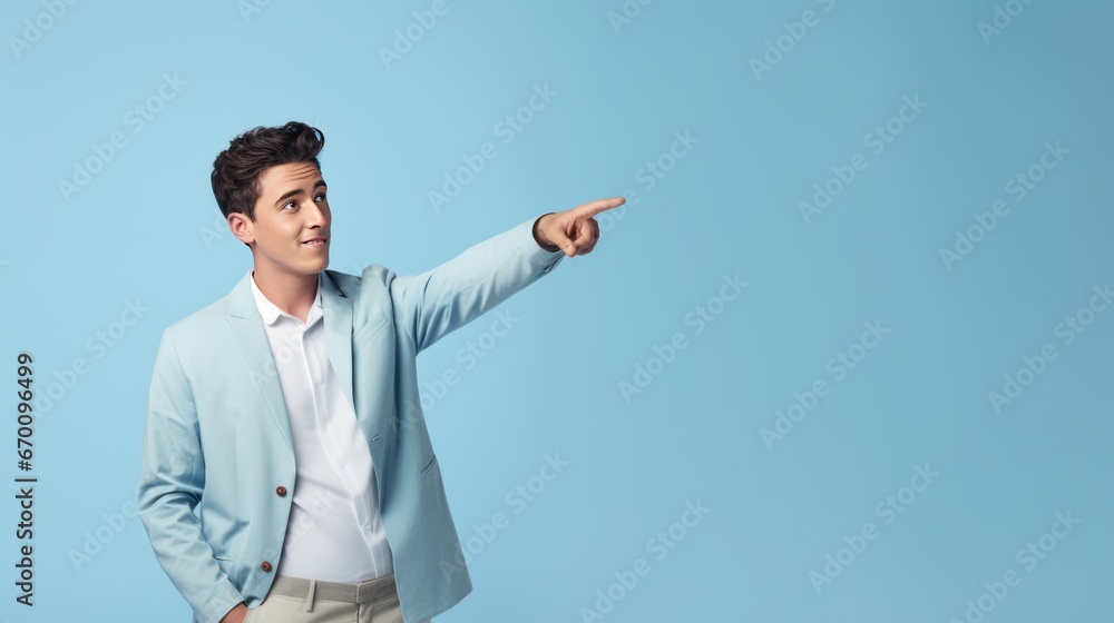 Young man pointing upward ,portrait of beautiful smiling man pointing ...