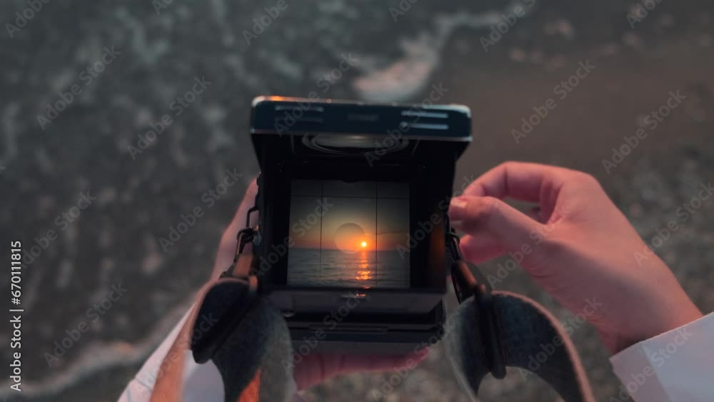 View through old film camera viewfinder. Female hands holding retro ...
