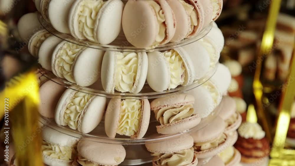 Fresh pastel coloured macaroons or macarons baked from almond flour and ...