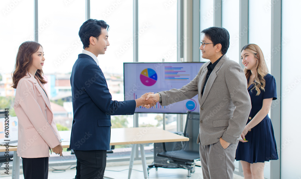 Asian professional successful two male businessmen partnership dealer and customer in formal ...