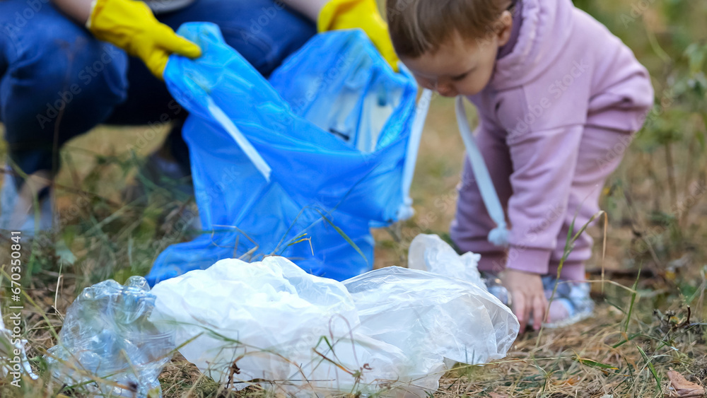 Infant girl joins mom in park cleanup mission to protect environment ...