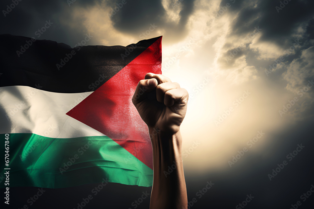 Strong hand against Palestine flag waving in the cloudy sky ...