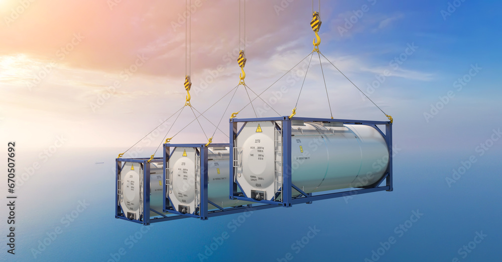 3 tank containers suspended on cables from cranes against the sky. Idea ...