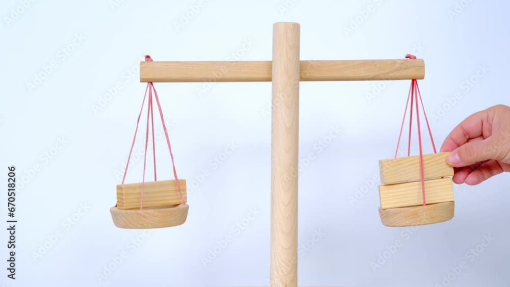 Wooden scales are weighing wooden blocks, concept of stability and ...