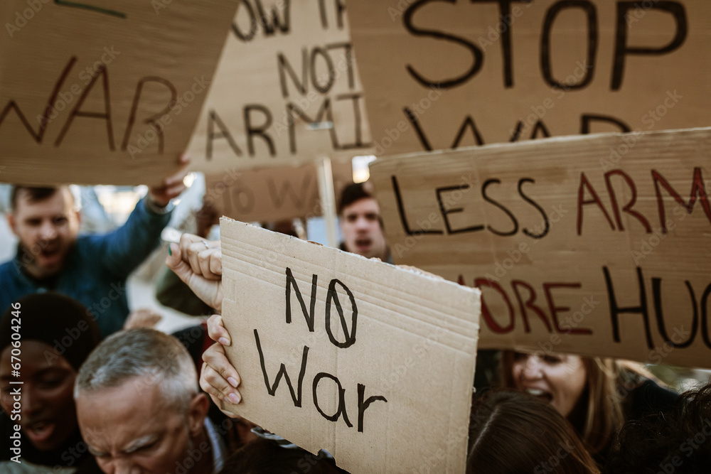 Group of activist people marching for world peace. Diverse ...