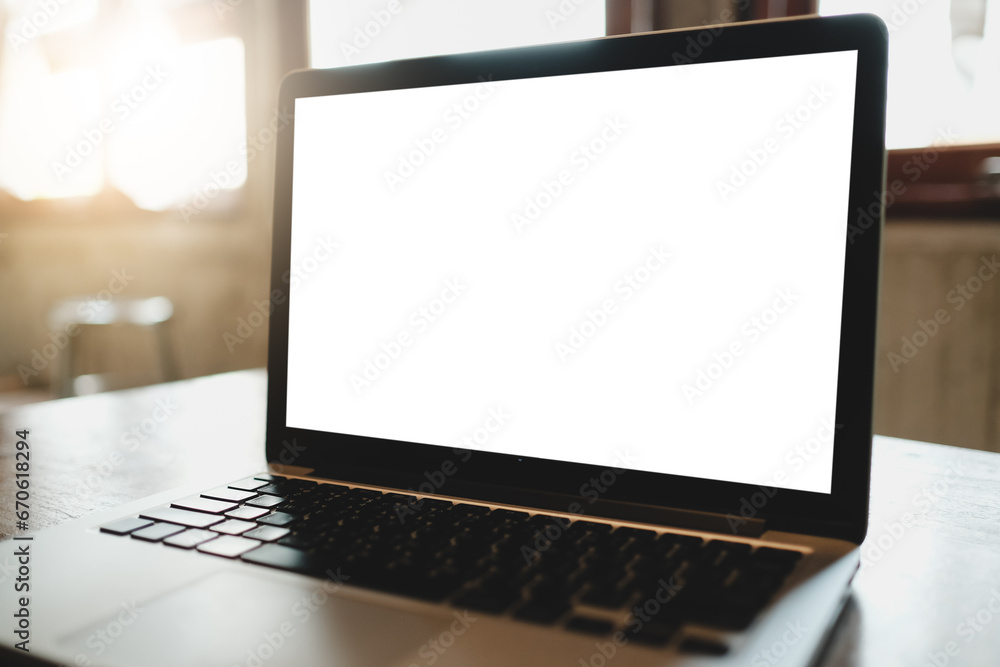 Laptop computer blank white screen on table in cafe background. Laptop ...