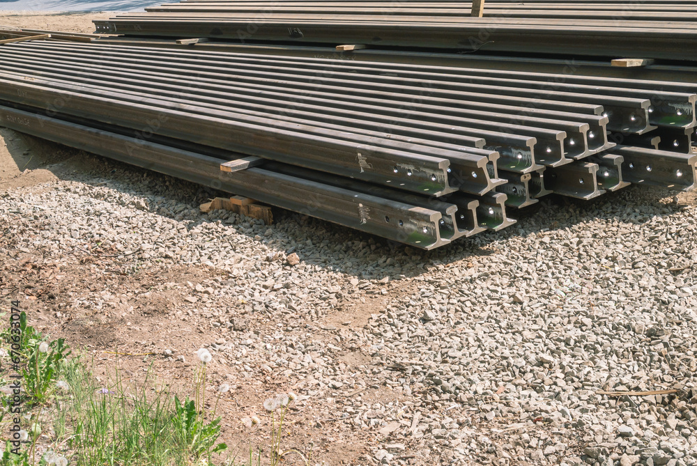 Steel rails of special cross-section laid on sleepers form the path ...