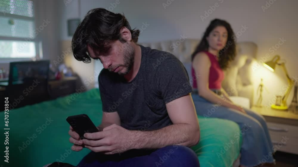 Disconnected couple: Boyfriend looking at phone ignoring girlfriend by ...