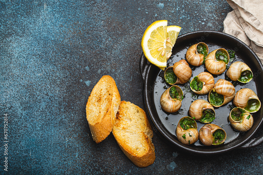 Escargots de Bourgogne Snails with Garlic Butter and Parsley in black ...