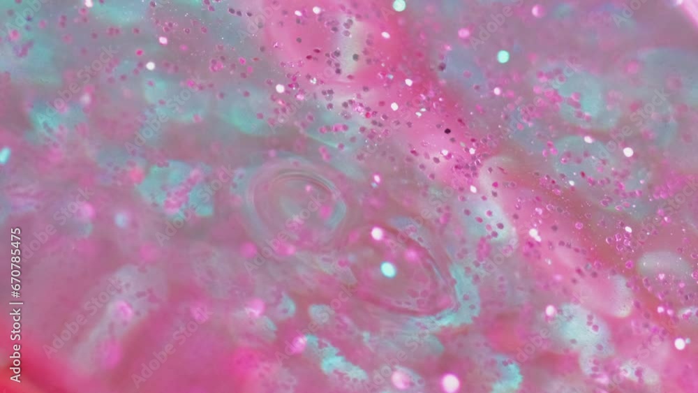 Glitter flow background. Magic liquid. Pink green shiny shimmer water with bokeh round spots ...
