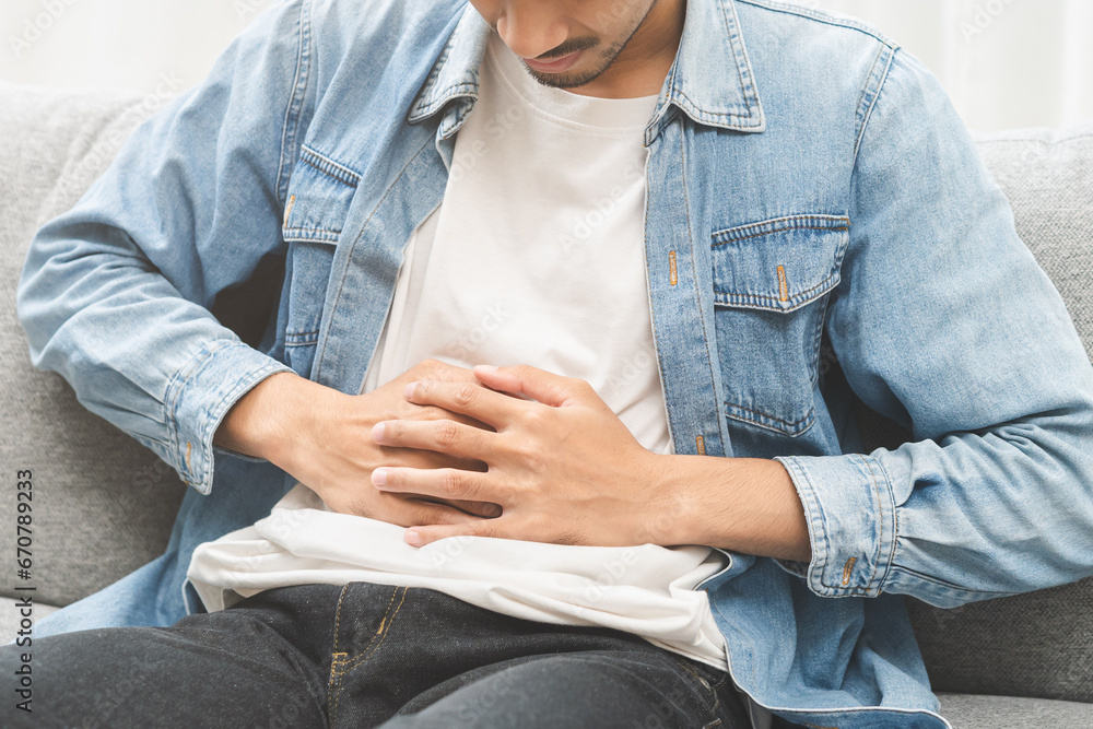 Flatulence ulcer, hurt suffer asian young man, male hand in belly ...