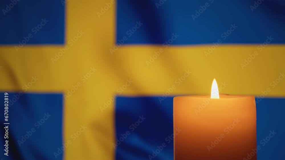 Vidéo Stock Sweden flag and burning candle. Tragedy and mourning in the ...