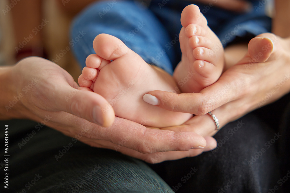 Close up view of baby feet. Mother touching her small child's toes ...