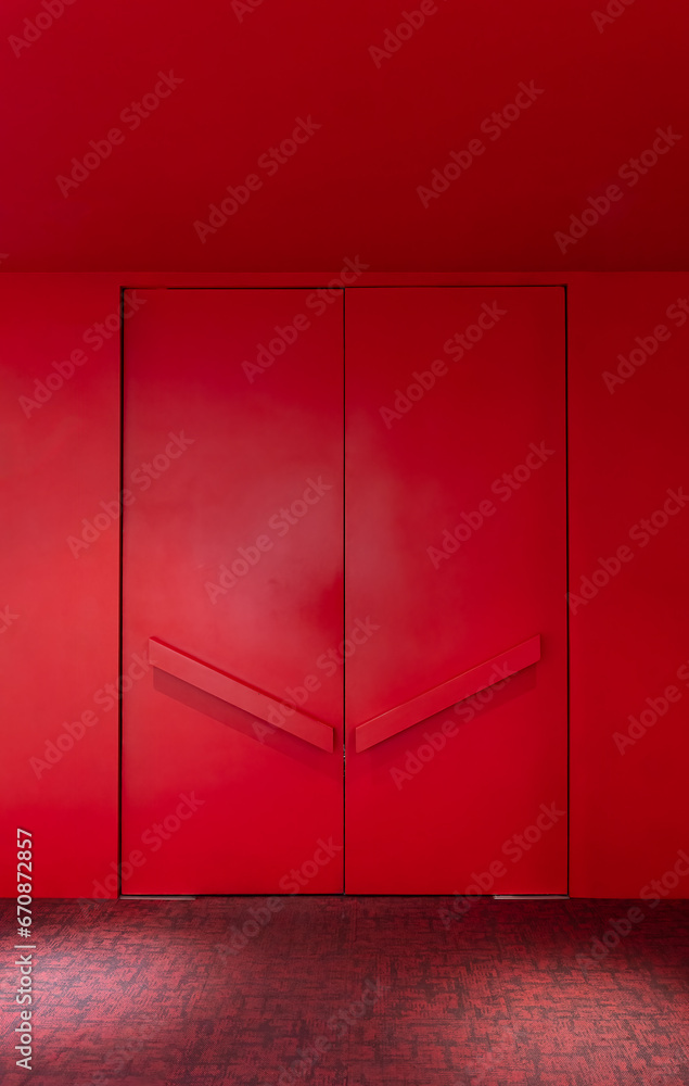 Large red door entrance to the meeting room in a red wall , Red wall ...
