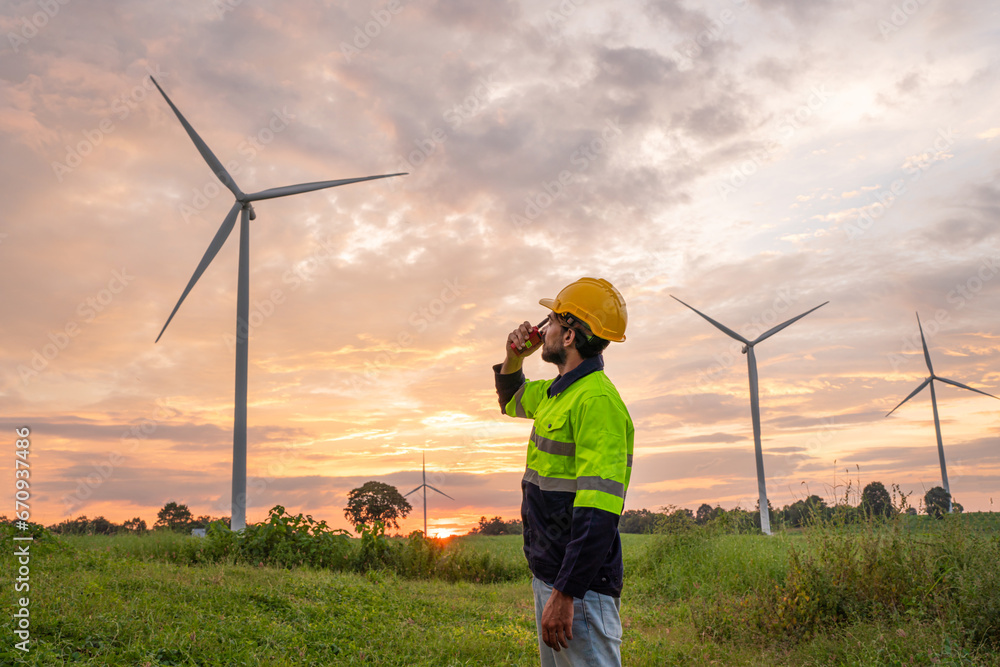 Engineer wearing uniform inspection and survey work in wind turbine ...