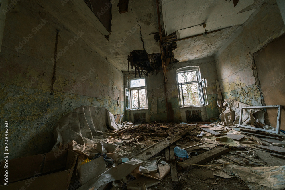 From above interior of shabby abandoned room with peeling painted walls ...