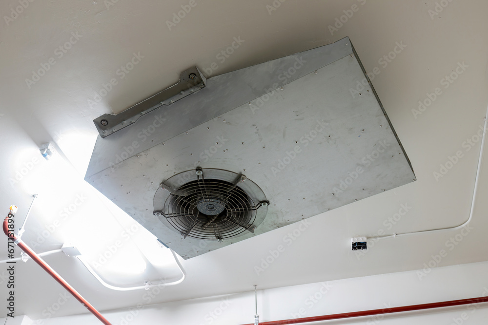 Fan in modern building Parking in door. Parking building ventilation ...