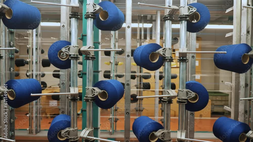 thread spools. textile industry. weaving factory. racks with many ...
