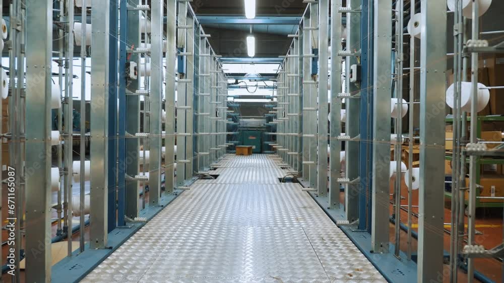 thread spools. textile industry. weaving factory. racks with many ...