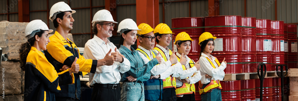 Confident and smiling lineup of factory worker, engineer, manager and ...