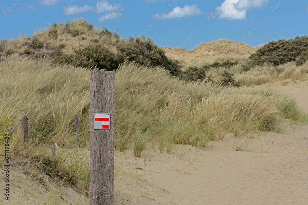 Path in the dunes with GR long distance footpath sign in `De Westhoek ...