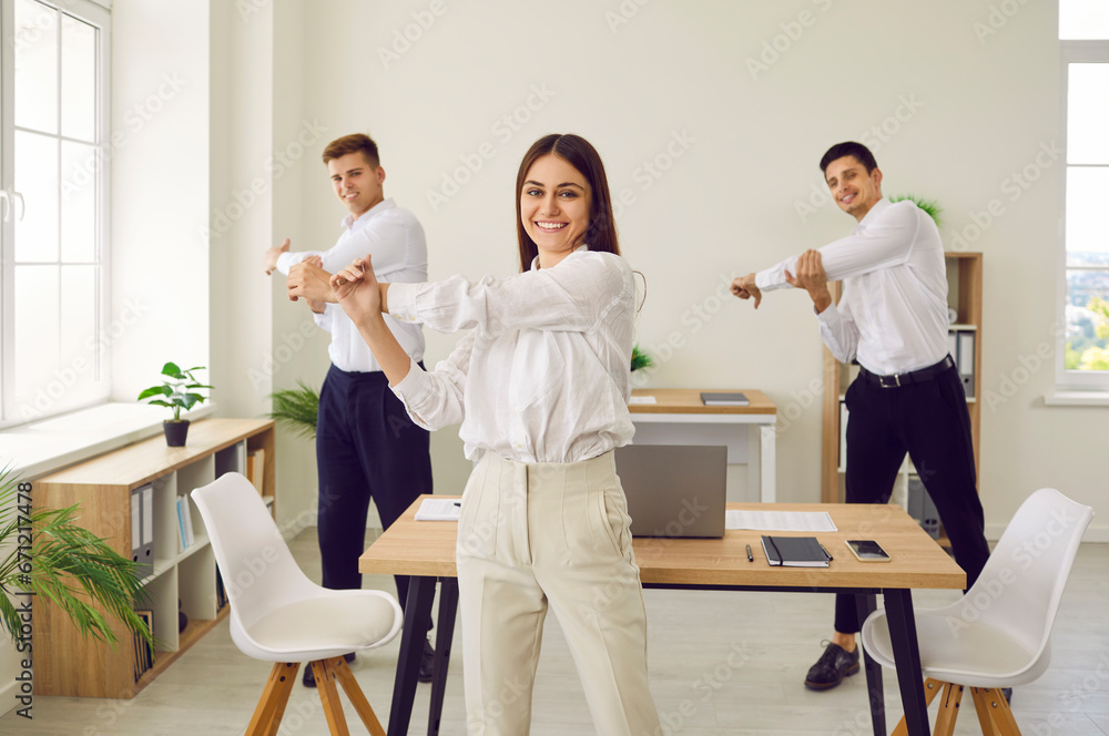 Happy corporate business team having fitness workout in office. Group ...