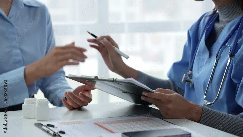 Asian female doctor or medical specialist examining a patient Ask for ...