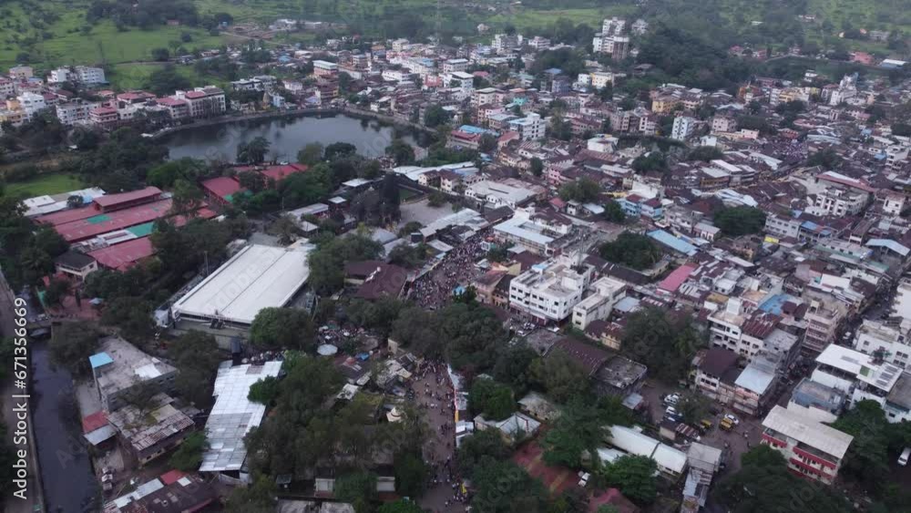 Drone shot of crowd of Hindu devotees walking towards Trimbakeshwar ...