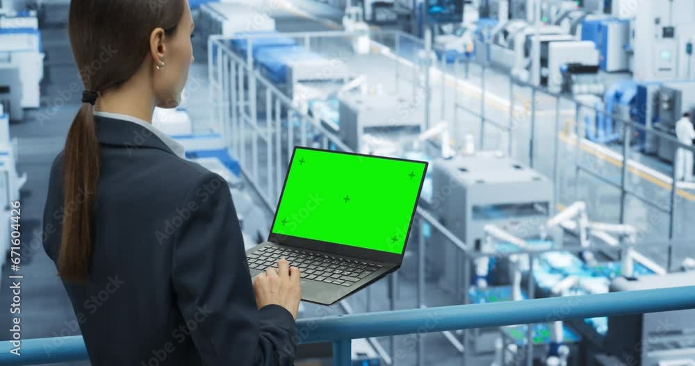 Female Technician Using Laptop Computer with Green Screen Chroma Key ...