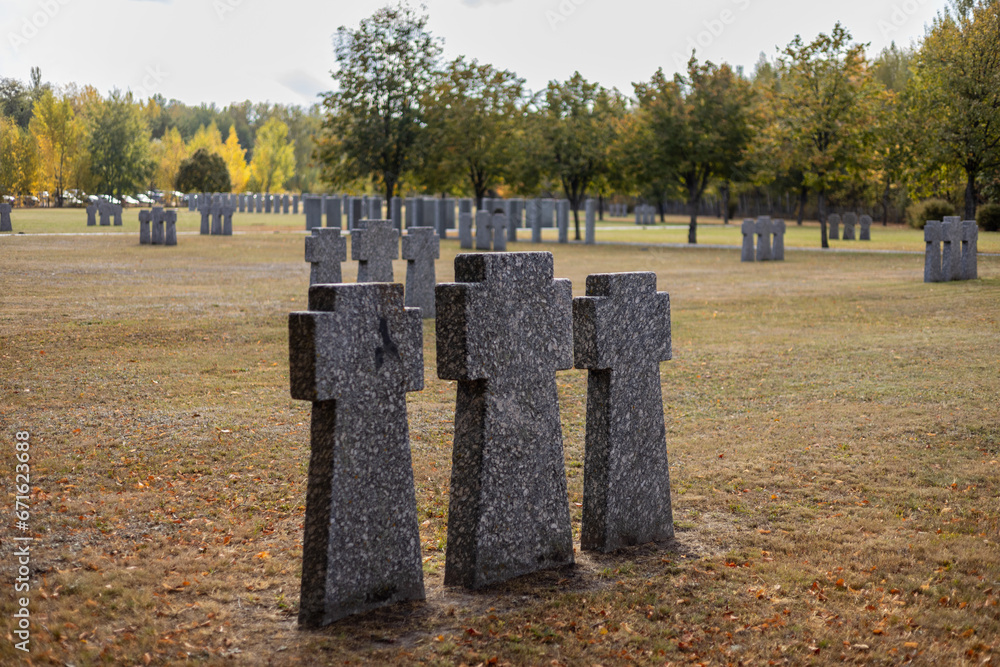 Stone tombstones in the German cemetery in the fall. Beautiful German ...