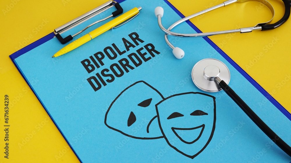 Bipolar disorder is shown using the text and picture of happy and sad ...