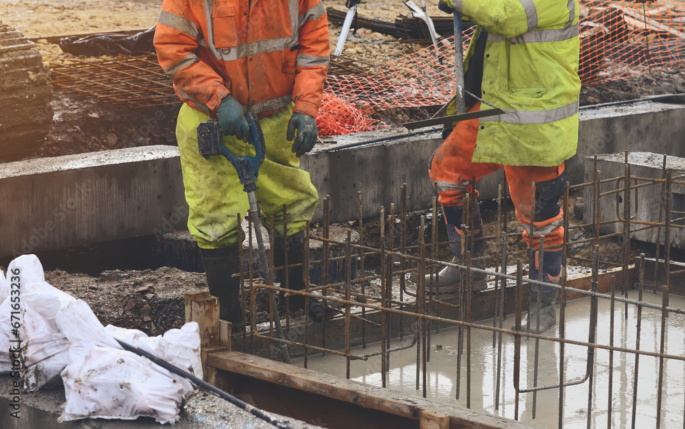 Concrete cast-in-place work. Builder level wet concrete. Concrete works ...