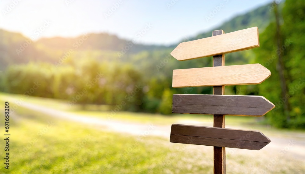 Wooden sign post isolated on village path with white clouds and ...
