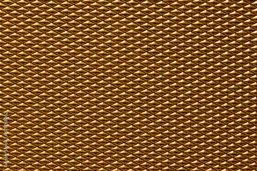 Seamless plastic texture background. Close-up of a detail from a gold ...