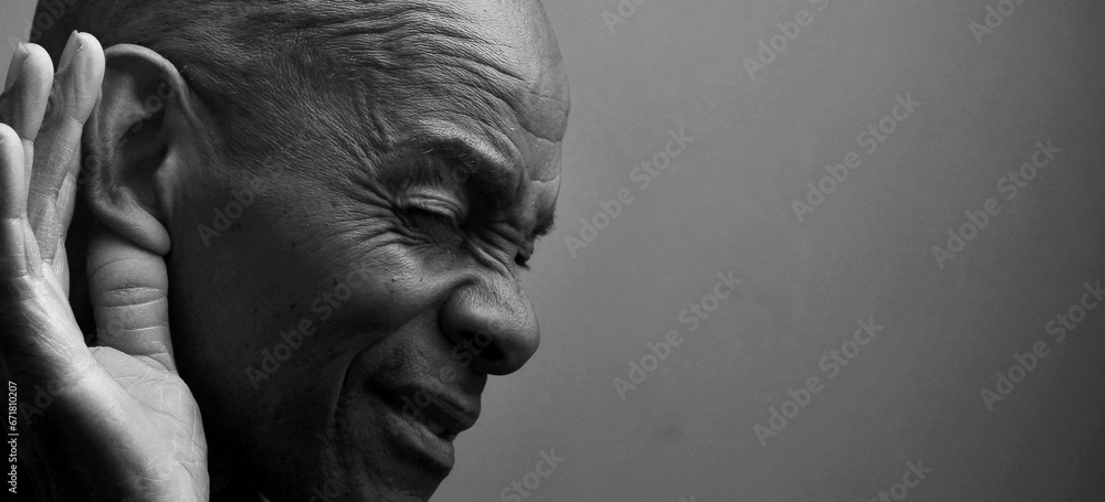 deaf man suffering from deafness and hearing loss on grey black ...