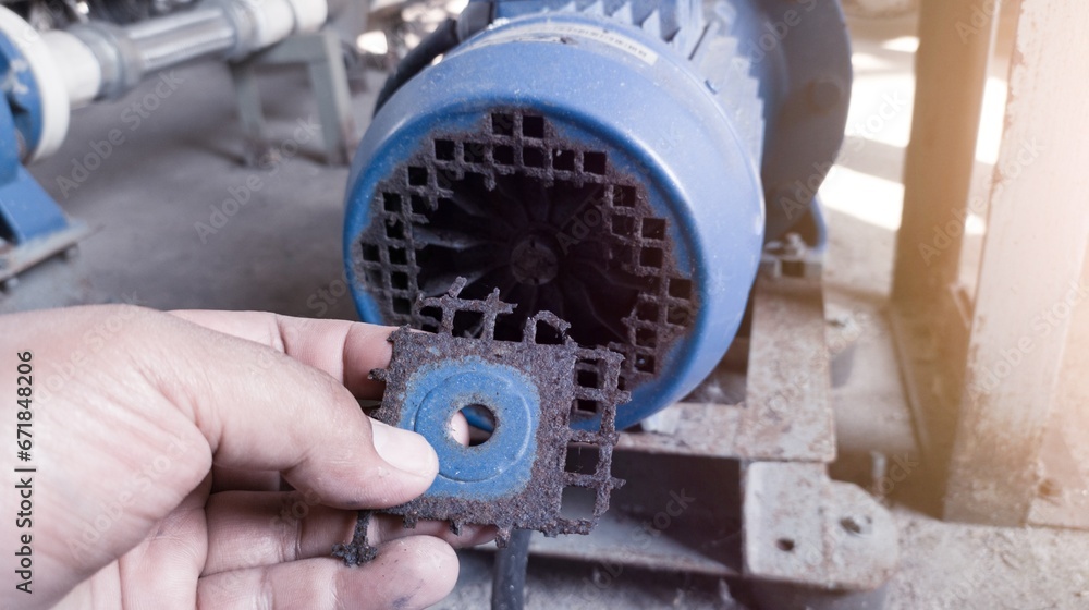 Checking for the cooling fan cover on the electric induction motor due ...
