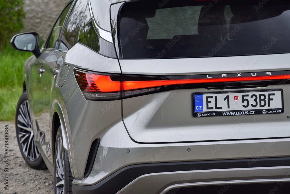 Lexus RX 450h+. A luxury car with a plug-in hybrid drive. Car rear ...