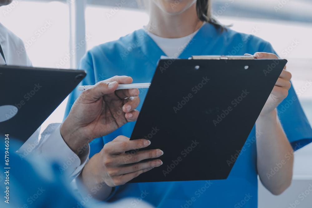 Injured patient showing doctor broken wrist and arm with bandage in ...