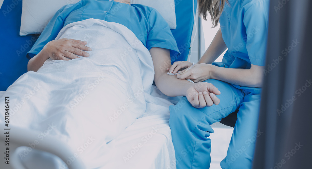 Injured patient showing doctor broken wrist and arm with bandage in ...