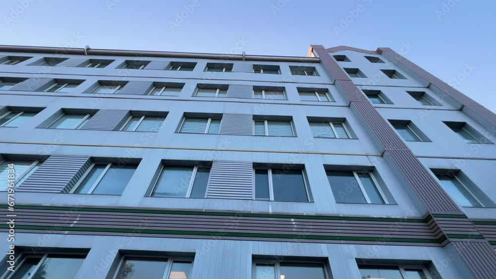 Modern factory office building, covered with metal building cladding ...