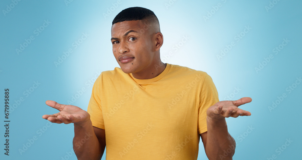 Confused, shrug and portrait of man in studio with why hands on blue ...