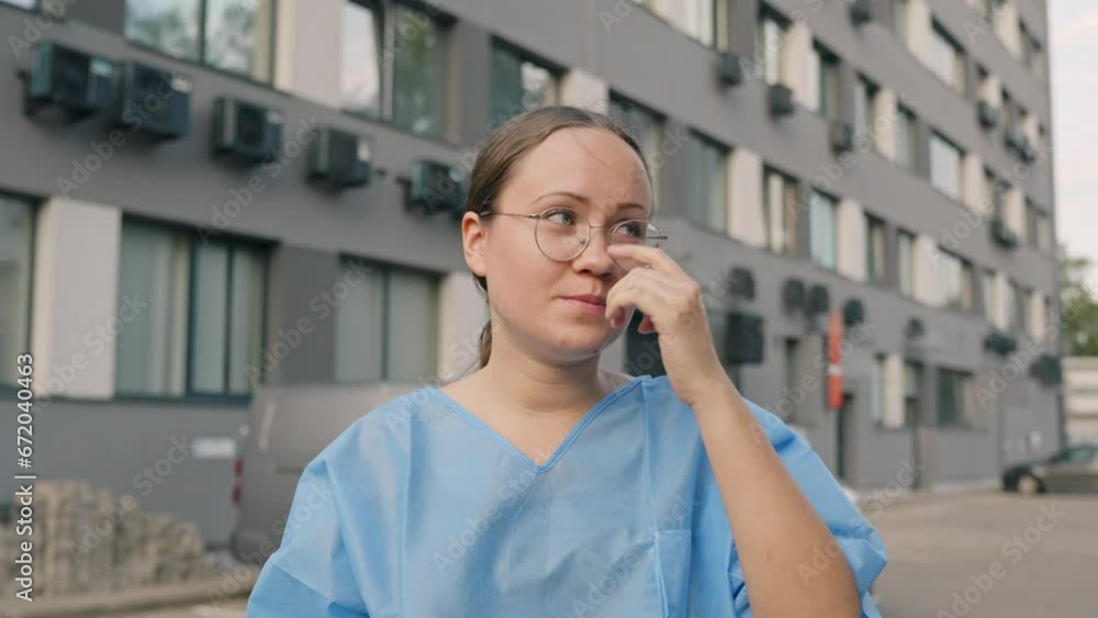 Woman displaying mixed body language of being uneasy, nervous, or ...