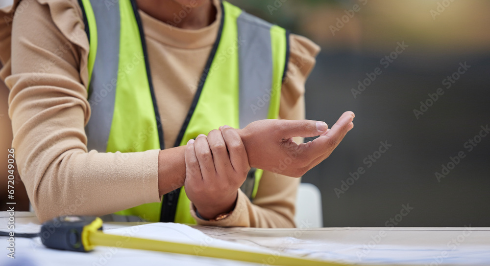 Industry, closeup and female construction worker with wrist pain ...