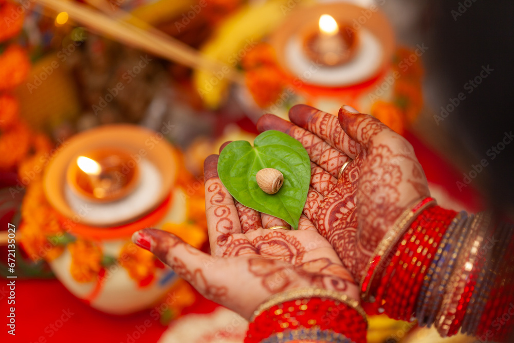 Beautiful hands of an Indian woman with betel nut along with betel leaf ...