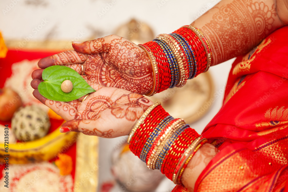 Beautiful hands of an Indian woman with betel nut along with betel leaf ...