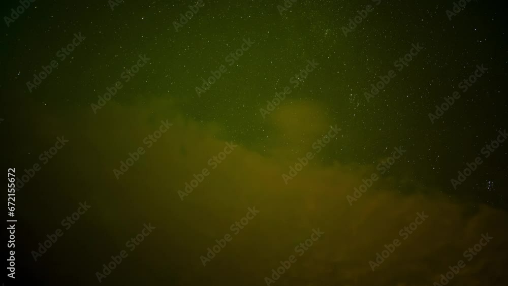 Beautiful Aurora Borealis shining in a starry night sky with falling ...