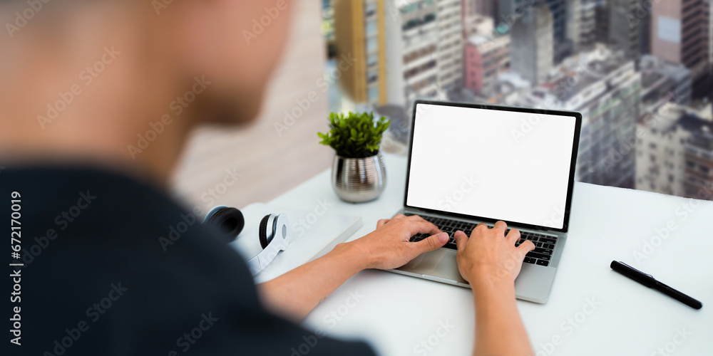 blank screen of man hand working on laptop computer and peper work ...