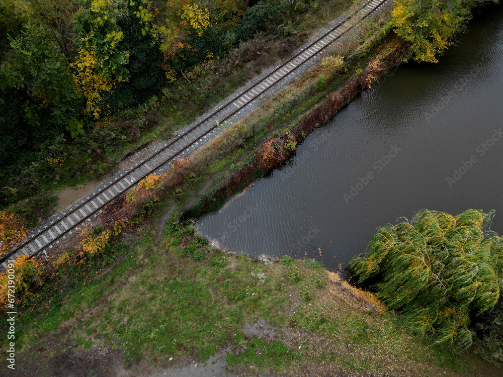 fly over railroad tracks in the countryside. vertical view of the ...